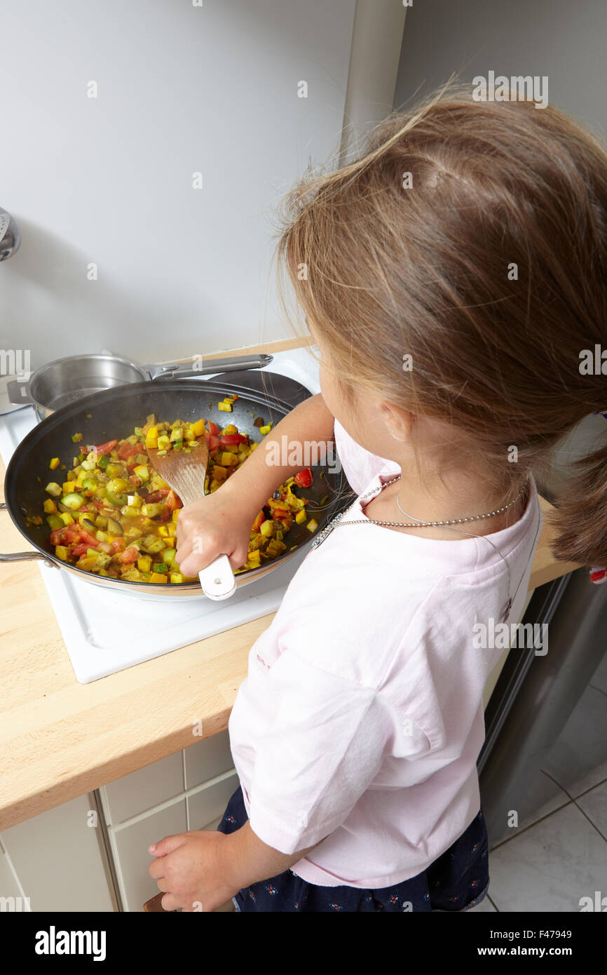 CHILD IN KITCHEN Stock Photo - Alamy