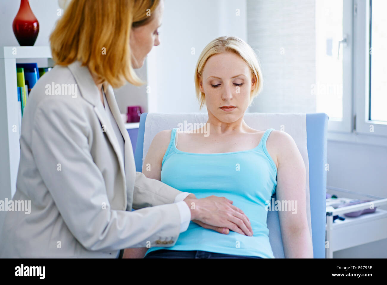 Abdomen palpation woman hi-res stock photography and images - Alamy