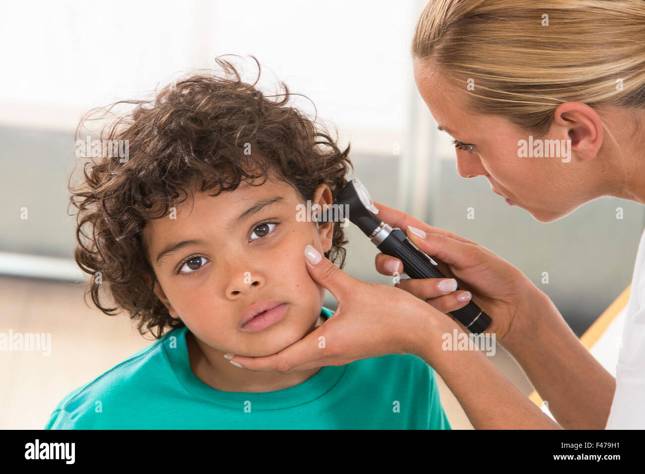 Nose and throat examination otoscope pediatrics pediatrician hi-res ...