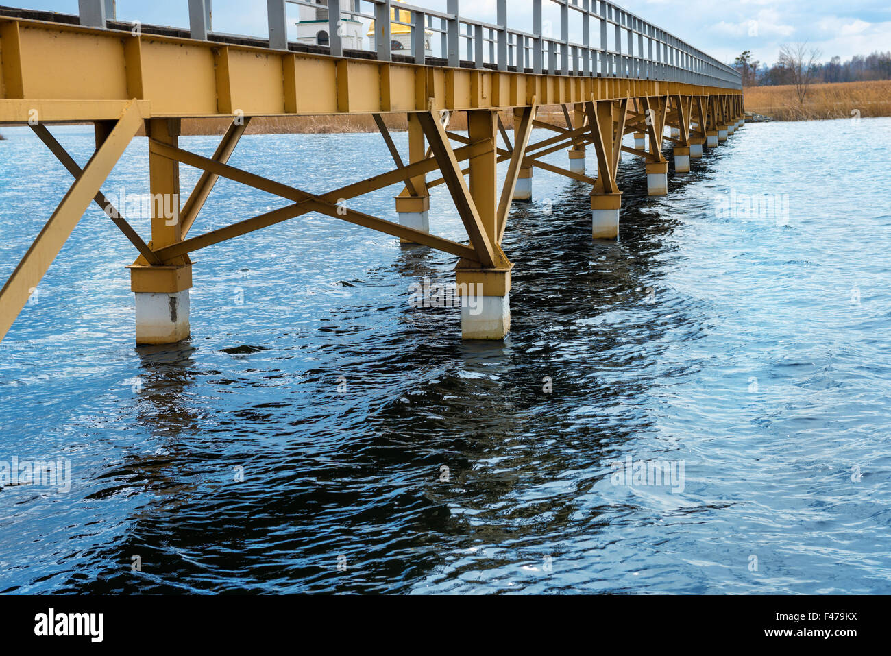 Steel bridge along river bank Stock Photo - Alamy