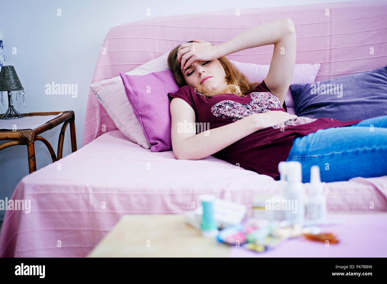 Sick women couch hi-res stock photography and images - Alamy