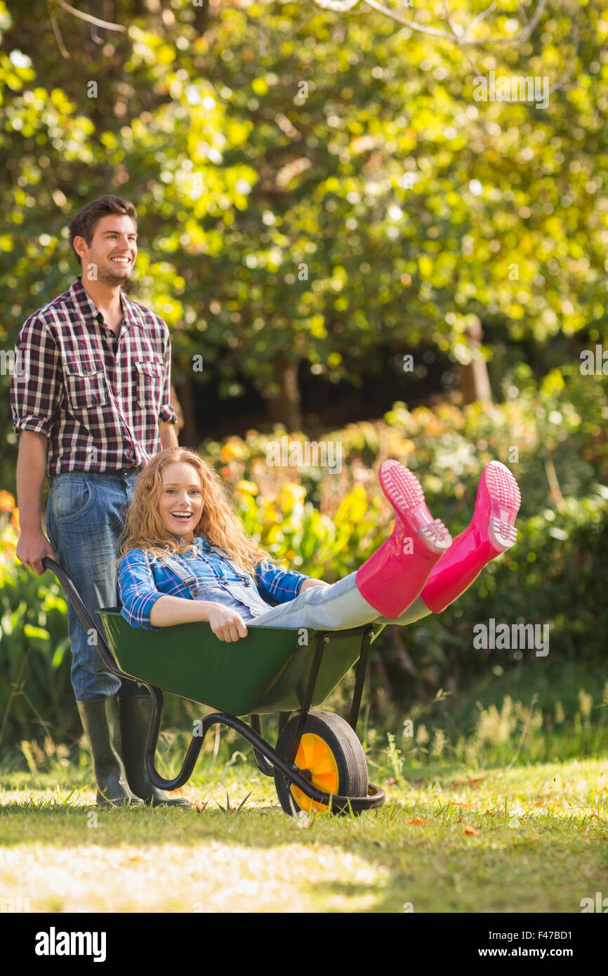 Man pushing his girlfriend in a wheelbarrow Stock Photo - Alamy Man pushing his girlfriend in a wheelbarrow Stock Photo - Alamy