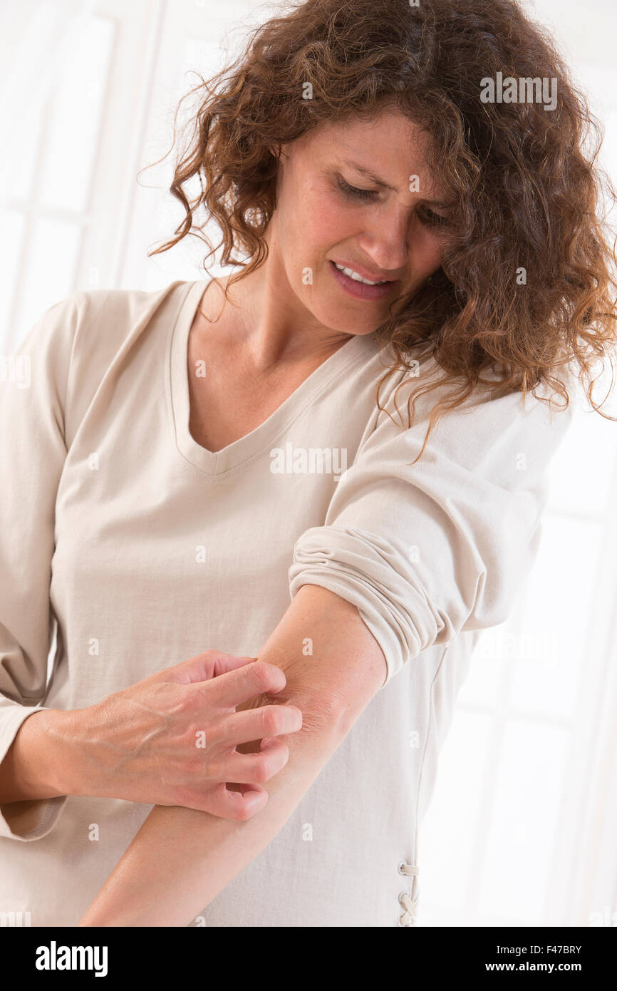 ITCHING IN A WOMAN Stock Photo - Alamy