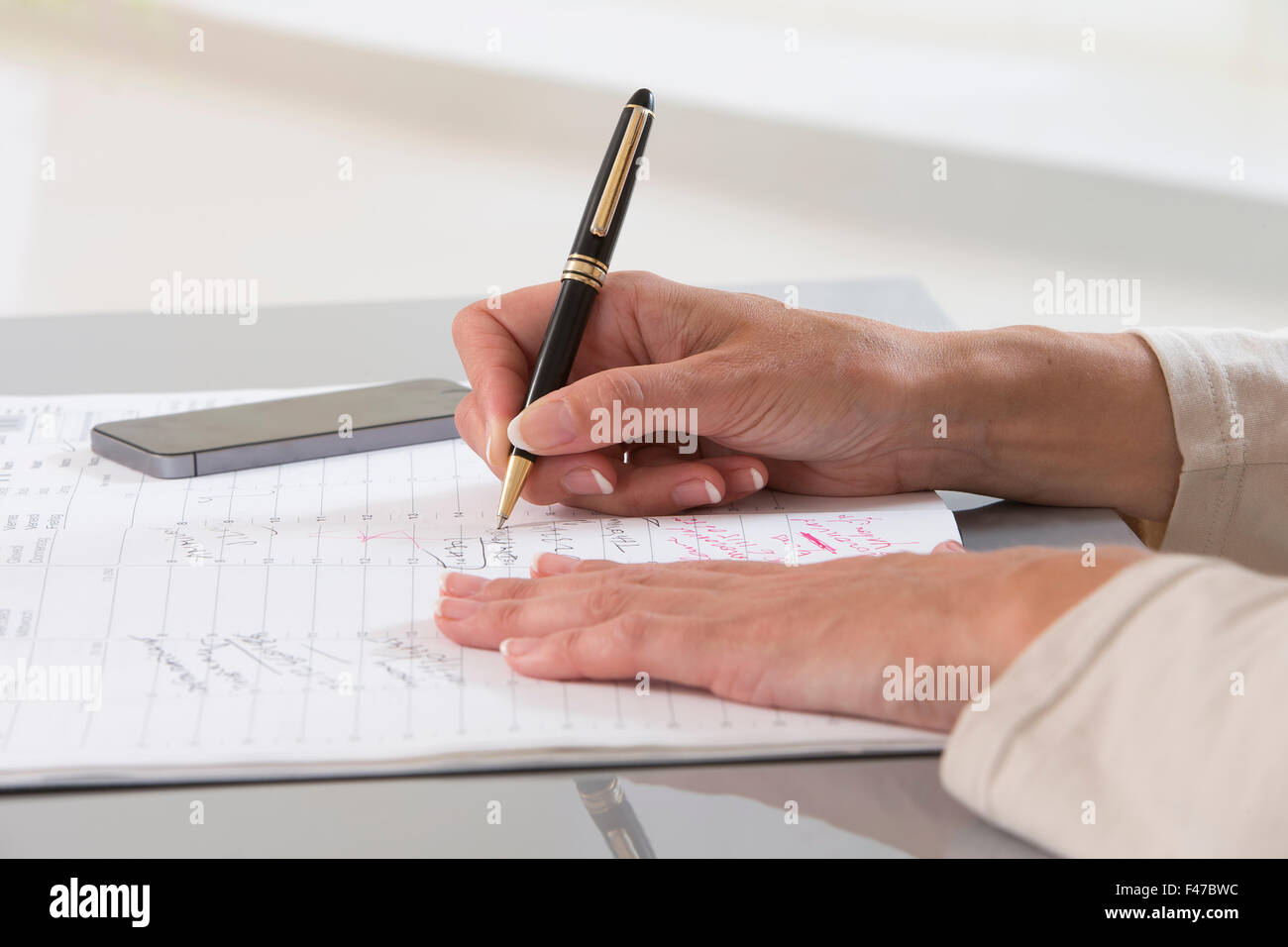 Mature woman writing on diary hi-res stock photography and images - Alamy