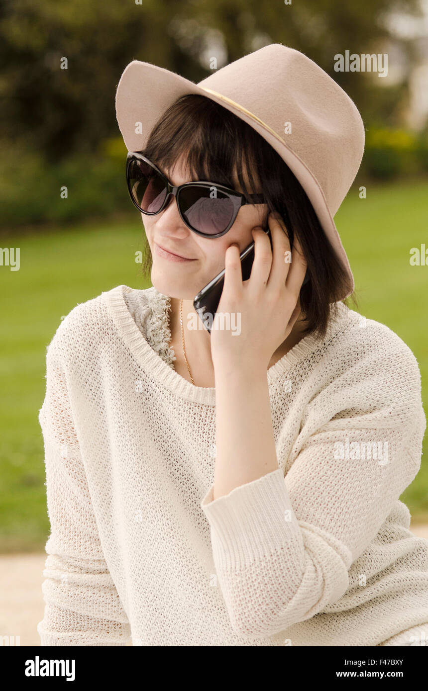 Woman outside with phone hi-res stock photography and images - Alamy