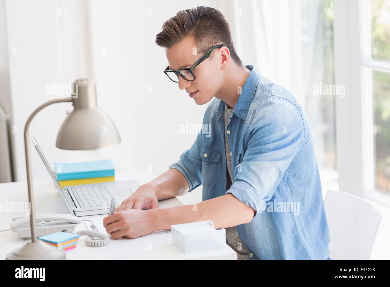 Happy handsome man working Stock Photo - Alamy