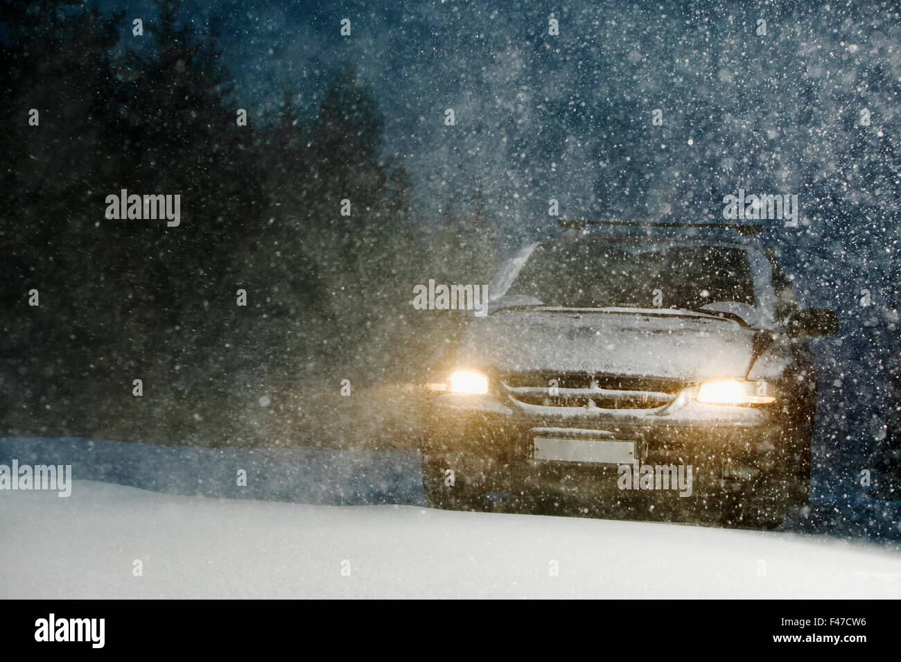 A car in snowfall, Sweden Stock Photo - Alamy