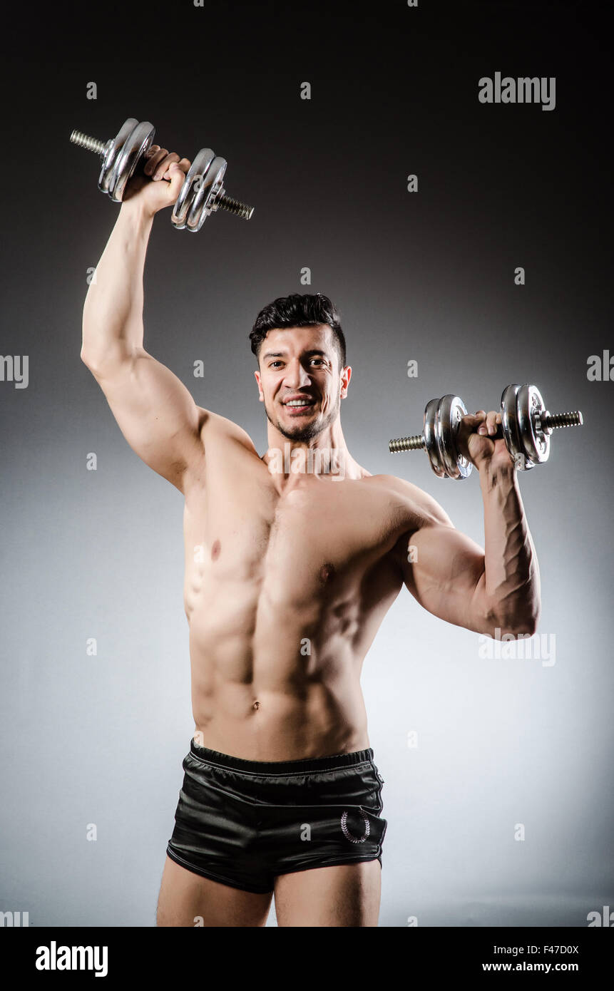 Muscular Ripped Bodybuilder With Dumbbells Stock Photo Alamy