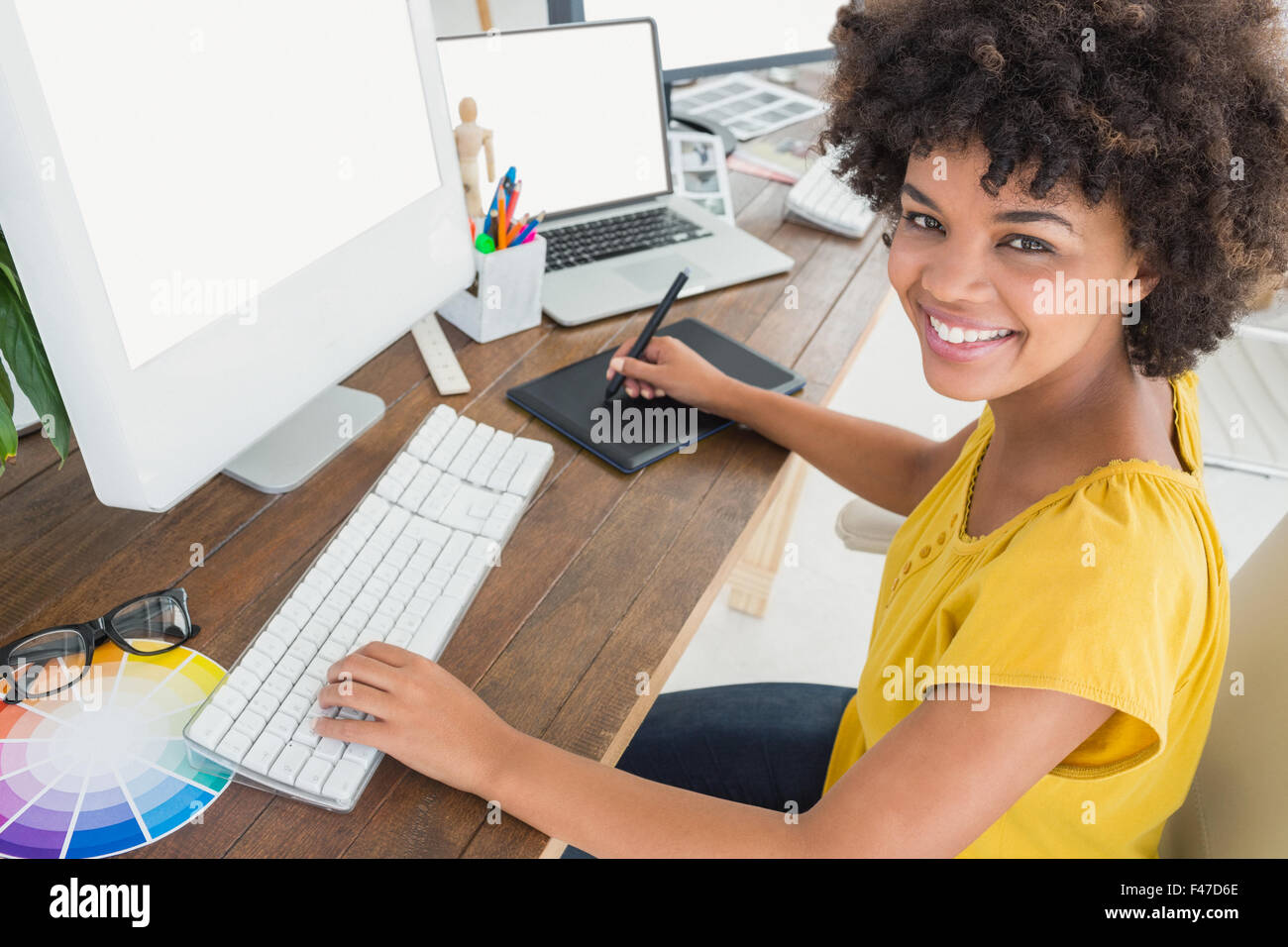 Graphic designer using a computer Stock Photo - Alamy