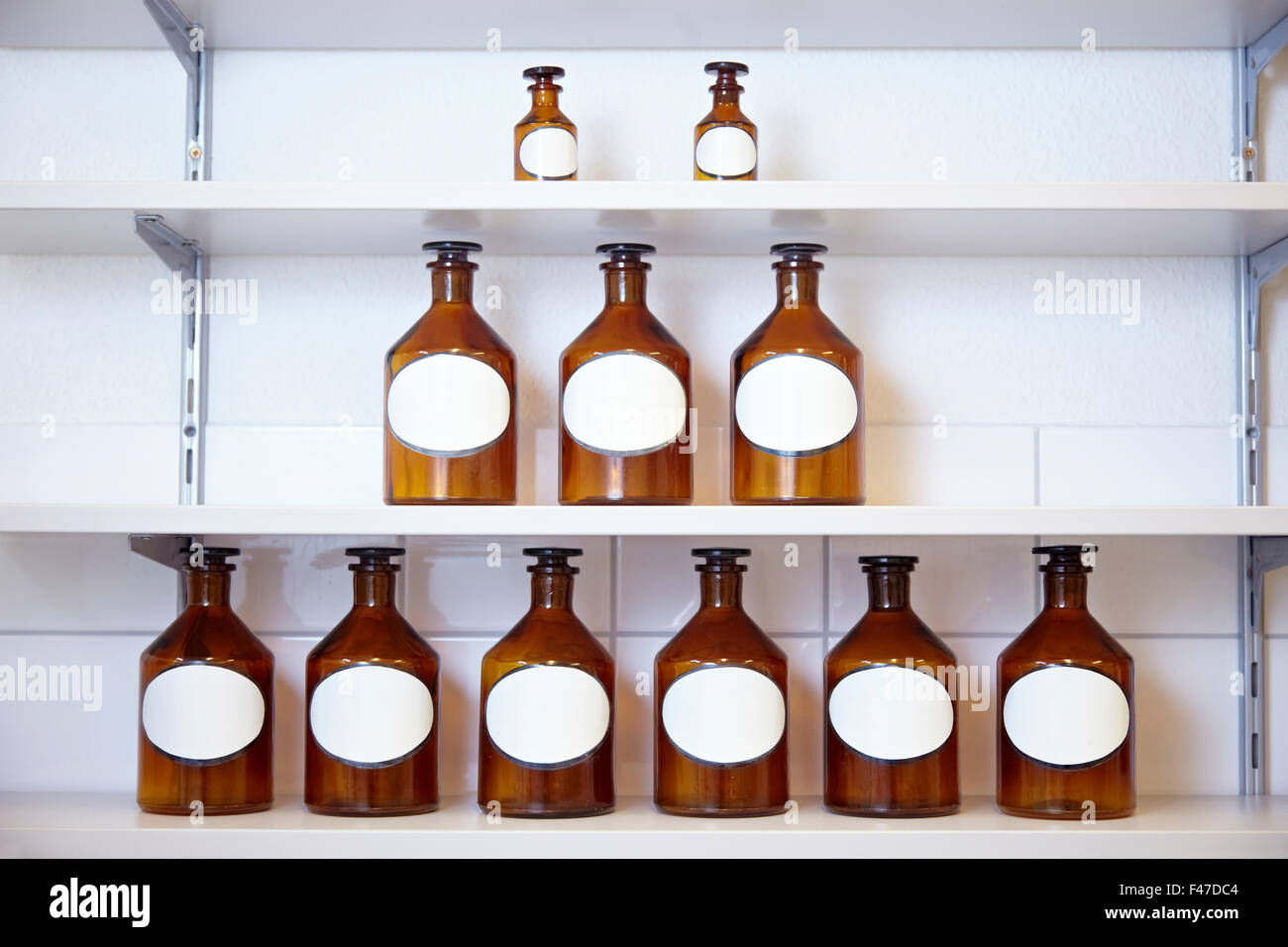 Eleven drug bottles in a pharmacy lab Stock Photo - Alamy