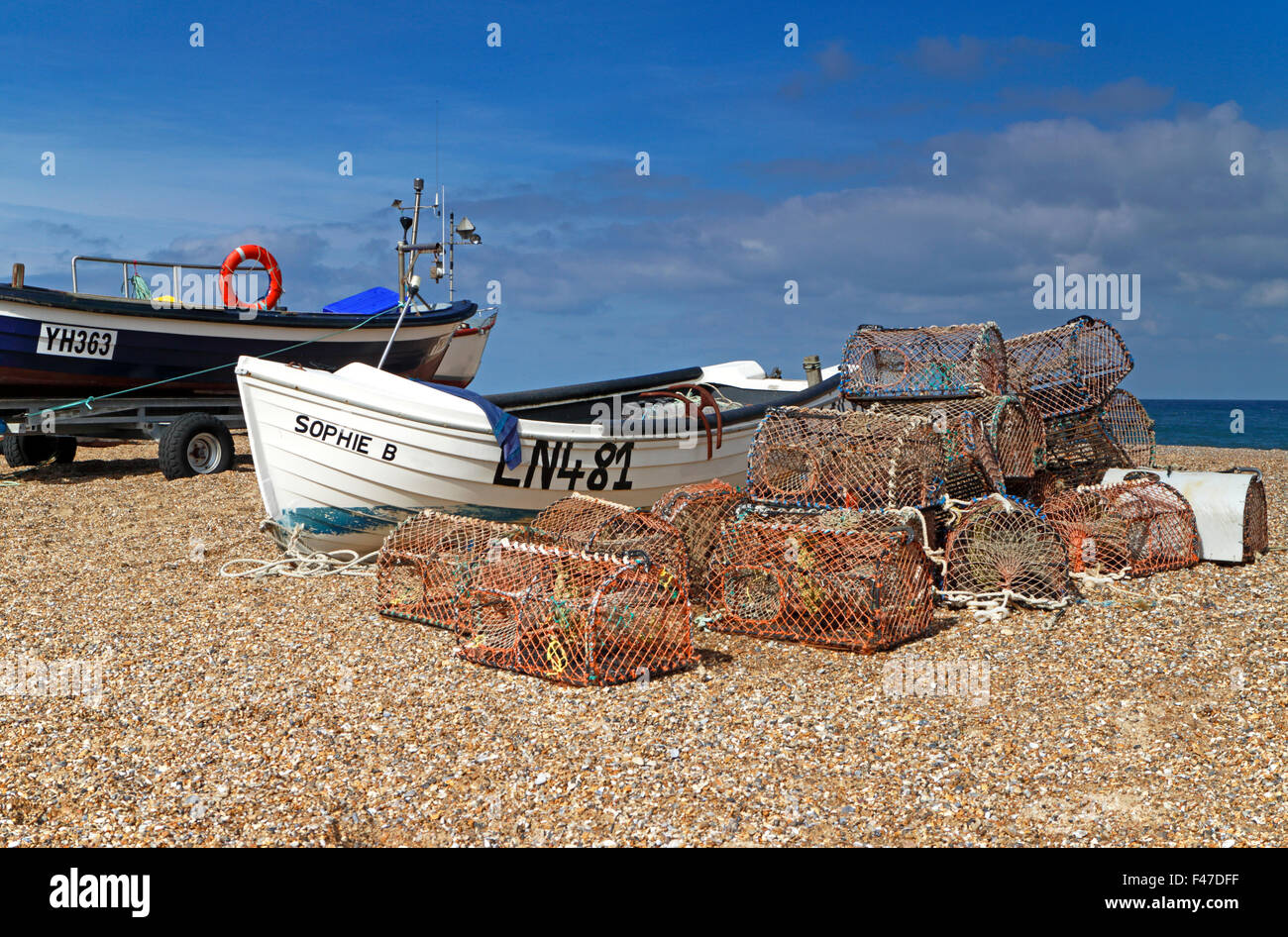Small inshore fishing boat with crab pots on the beach at Cley-next-the ...