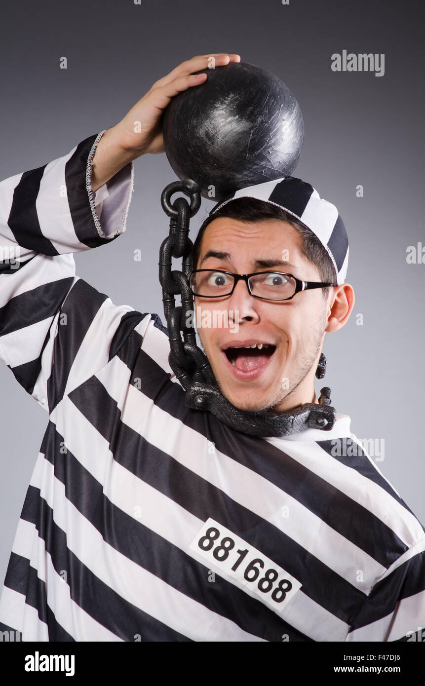 Funny prisoner in chains isolated on gray Stock Photo - Alamy