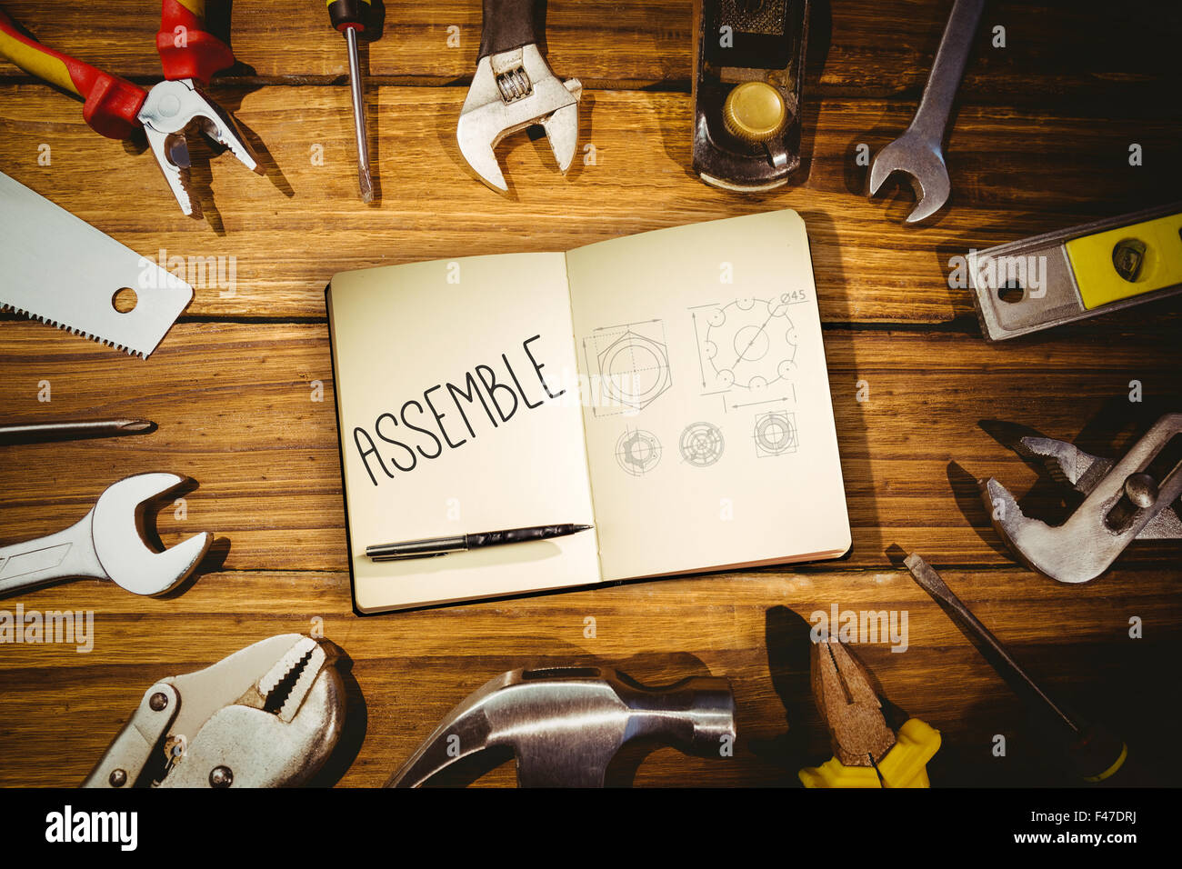 Assemble against blueprint Stock Photo - Alamy