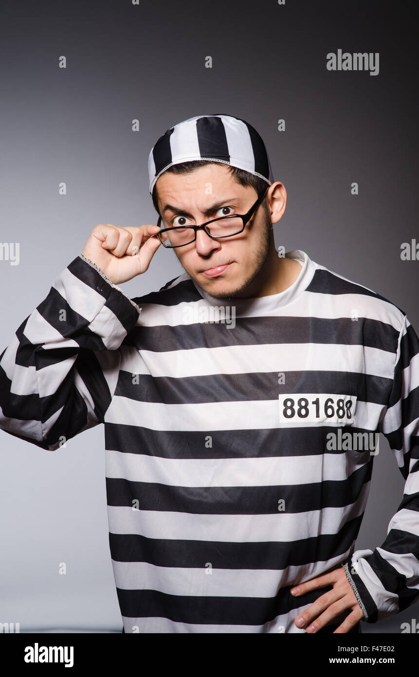 Funny prisoner isolated on gray Stock Photo - Alamy