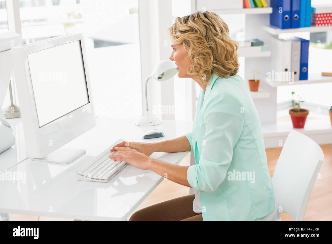 Smiling happy businesswoman working hi-res stock photography and images ...