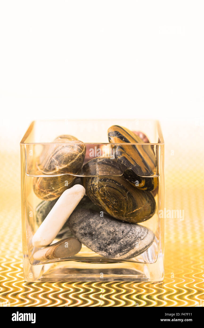 glass beaker filled with water and stones Stock Photo - Alamy