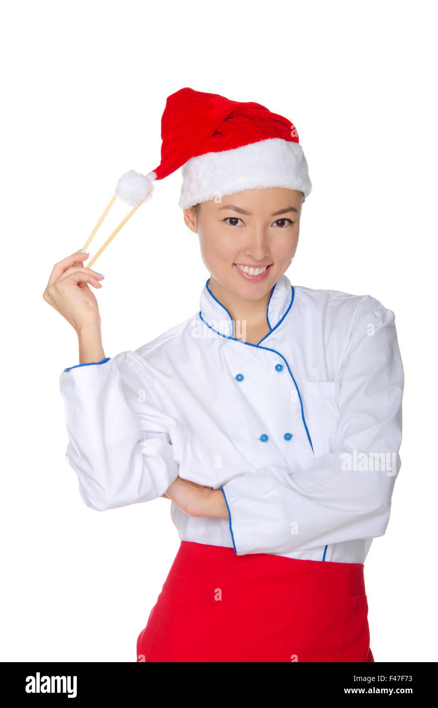 East chef holding chopsticks Christmas cap Stock Photo - Alamy