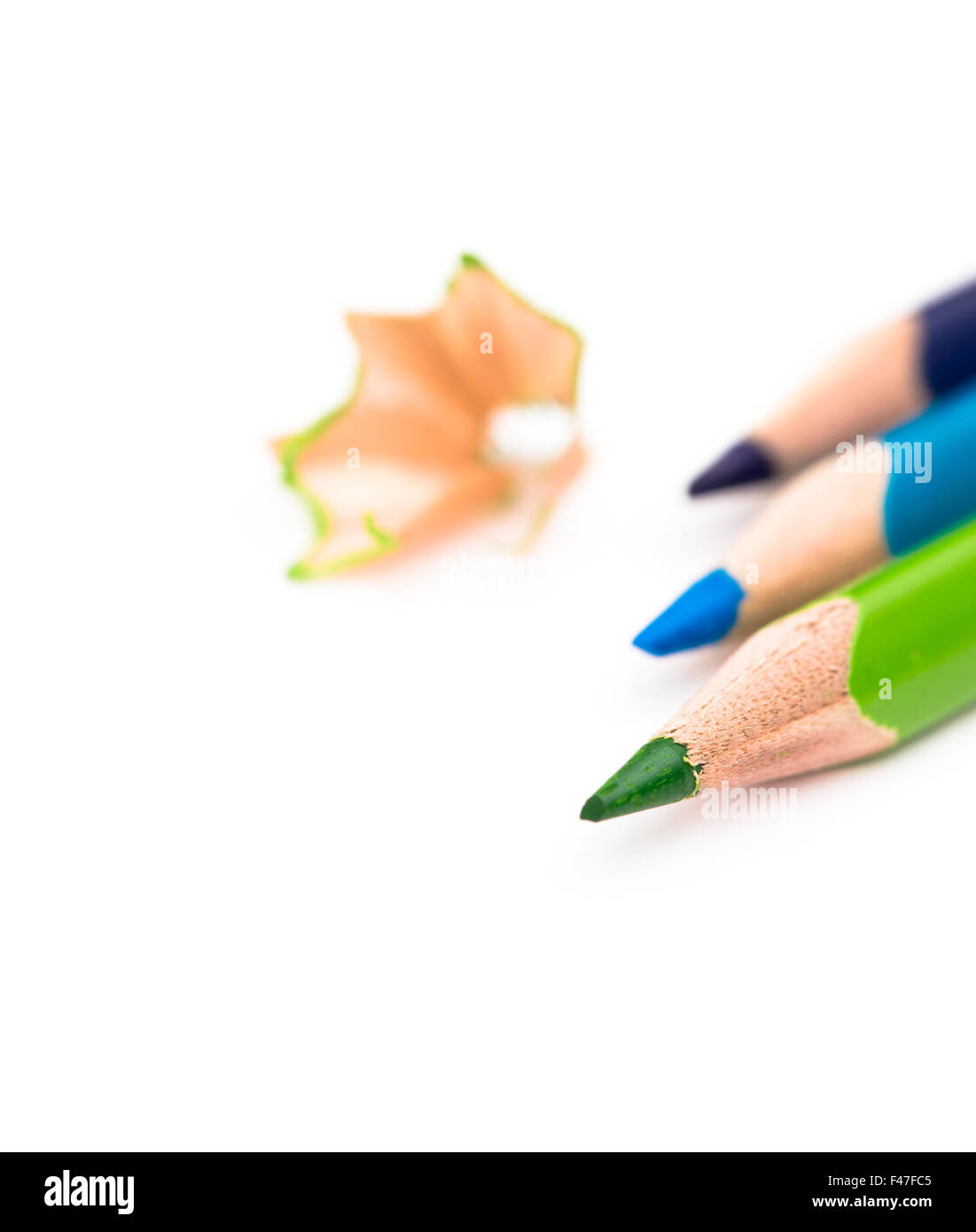 Three colored pencils on a white background isolated Stock Photo - Alamy
