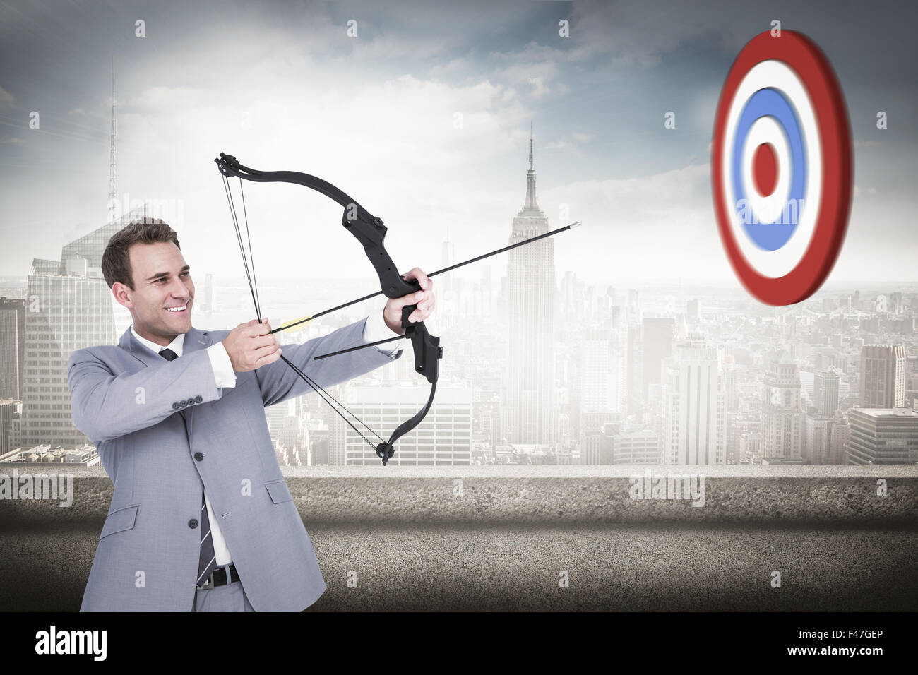 Composite image of businessman shooting arrow Stock Photo - Alamy