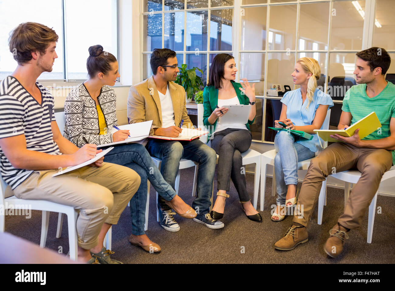Attentive creative business people in meeting Stock Photo - Alamy