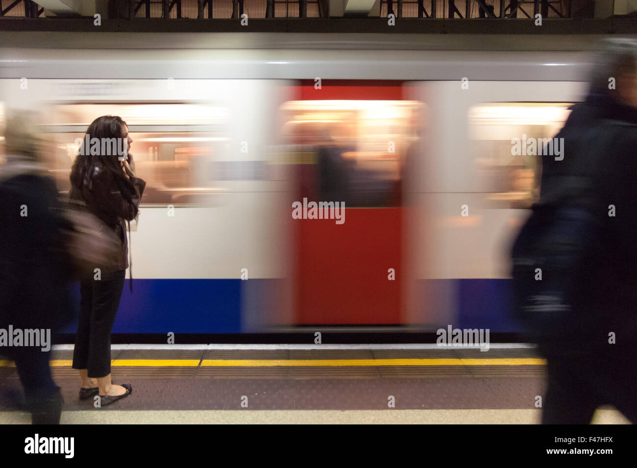 moving Underground train at station platform Stock Photo - Alamy