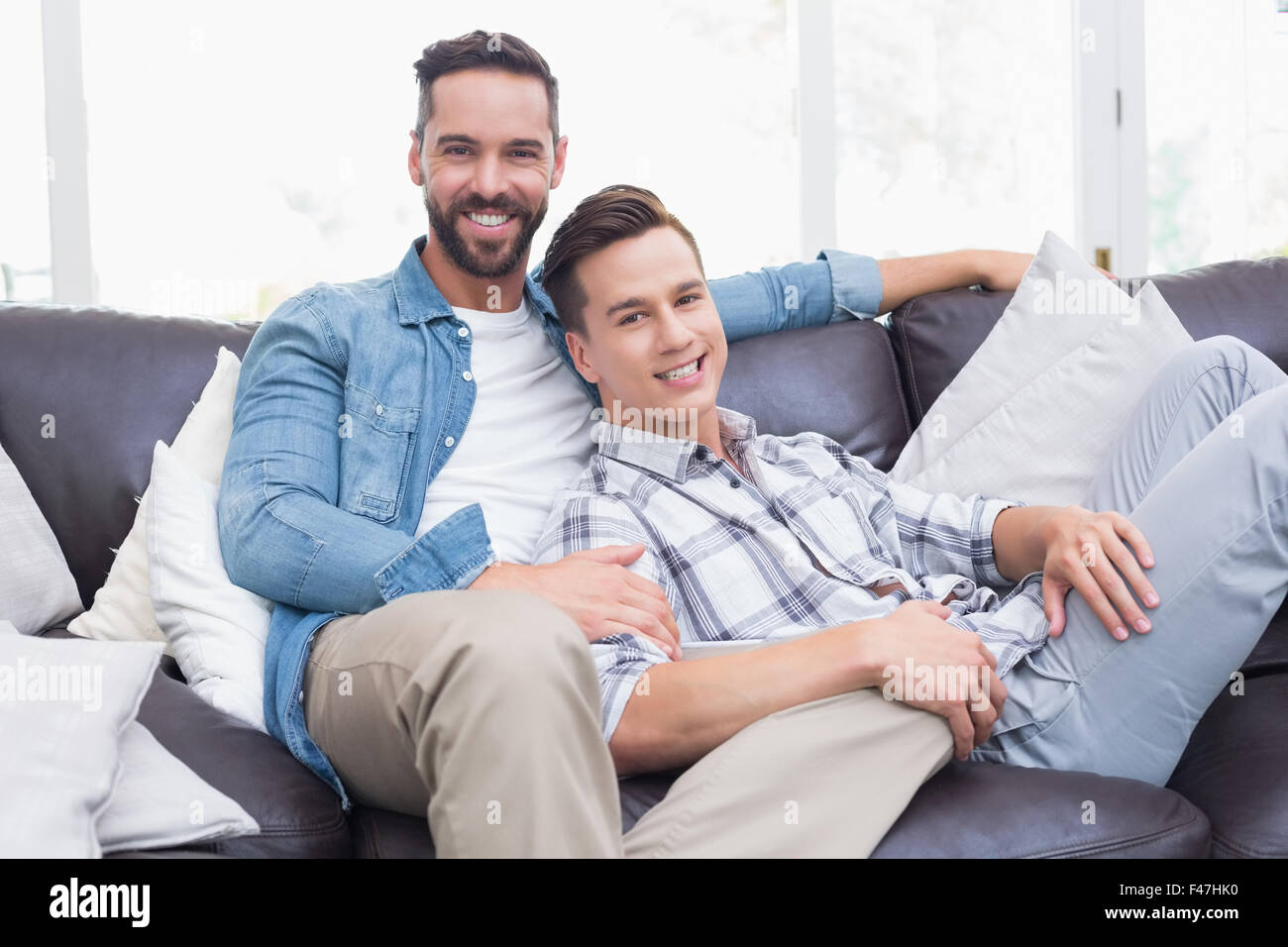 Homosexual couple men lying together Stock Photo - Alamy