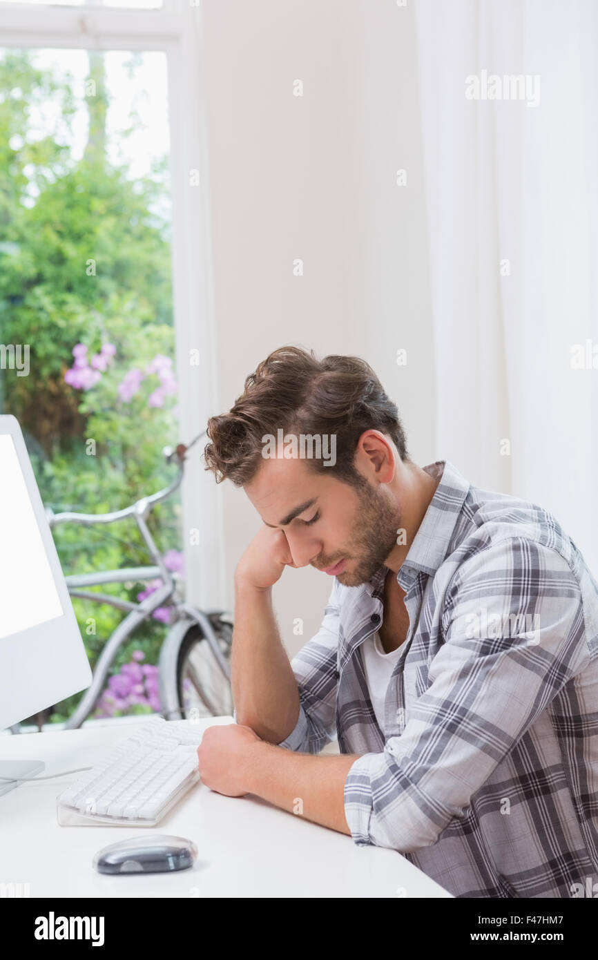 Handsome man sleeping behind computer Stock Photo - Alamy