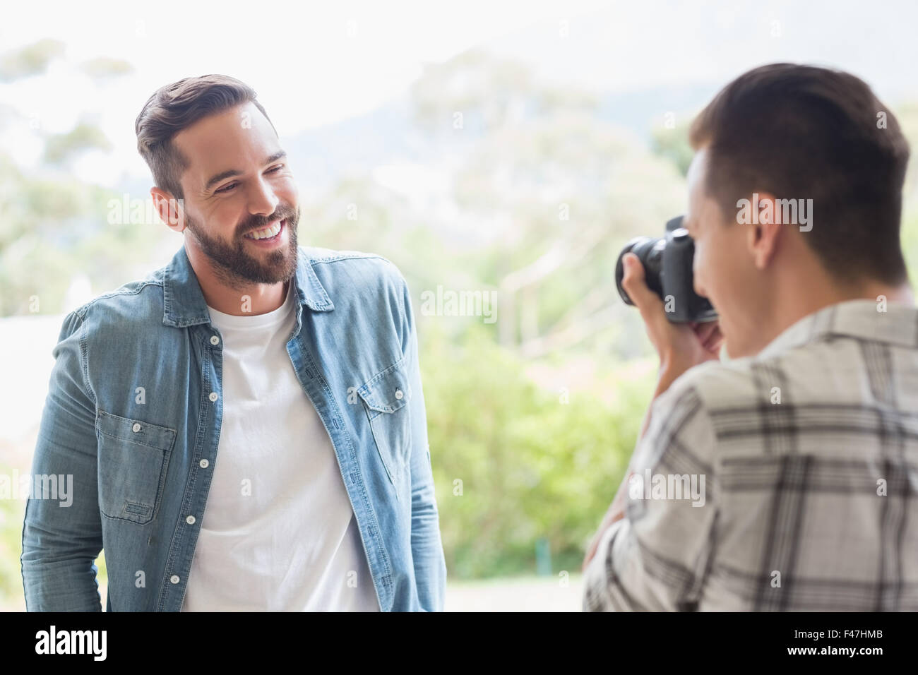 Homosexual couple men taking photo a digital camera Stock Photo - Alamy