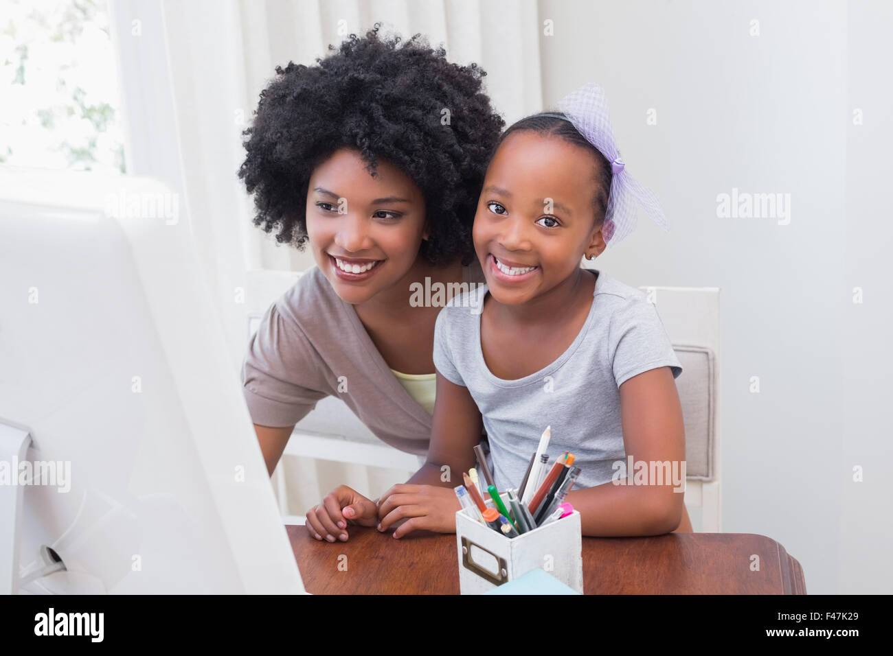 Happy family using the computer Stock Photo - Alamy