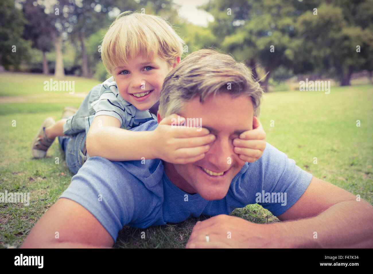Happy father and his son smiling at camera Stock Photo - Alamy