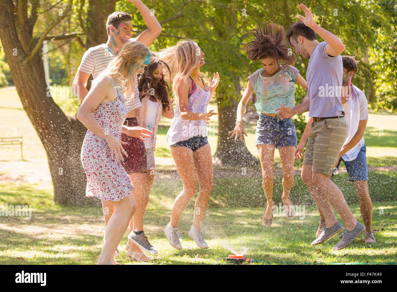 Friends having fun with powder paint Stock Photo - Alamy