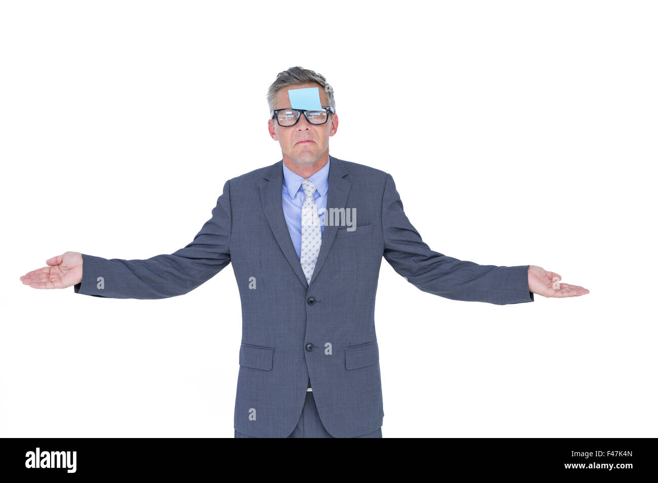 Businessman with post it on his face Stock Photo - Alamy
