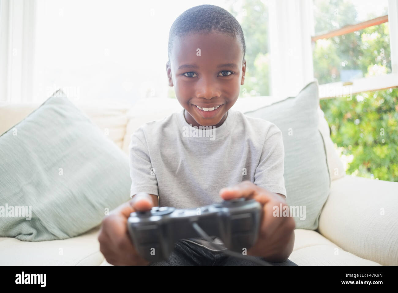 Little boy playing video games Stock Photo - Alamy