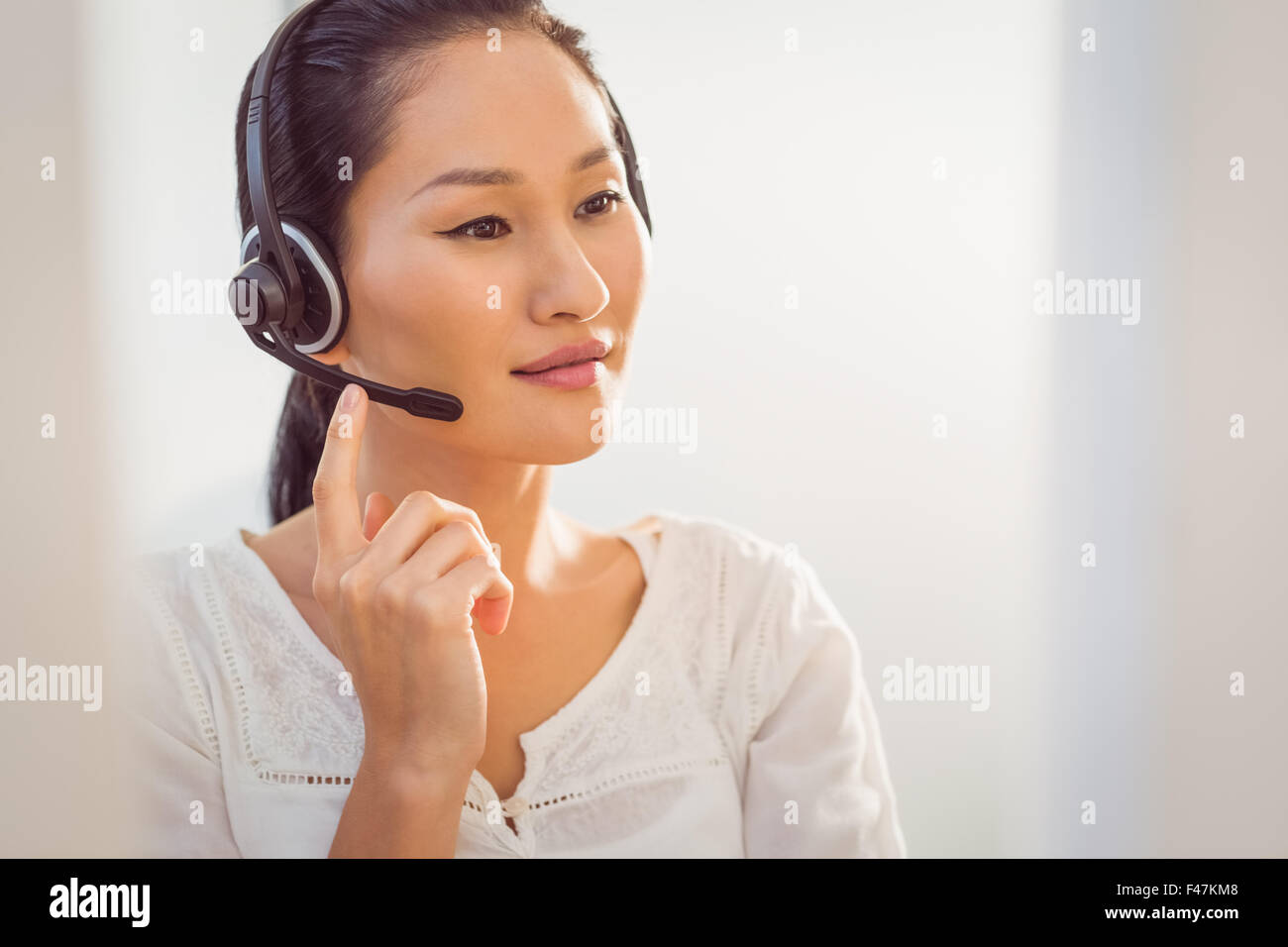 Call centre representative using headset Stock Photo - Alamy