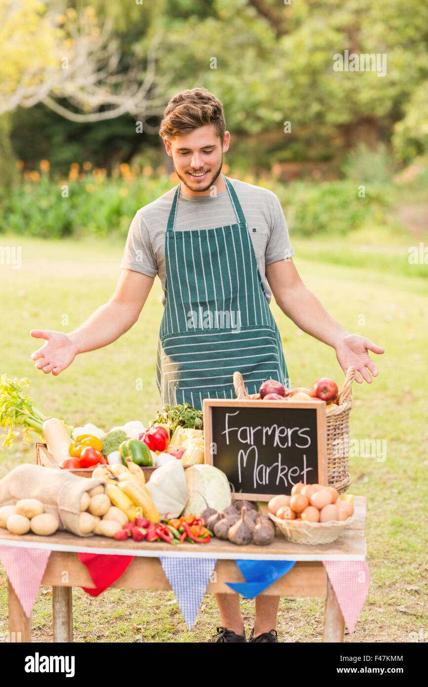 Handsome farmer standing at his stall Stock Photo - Alamy