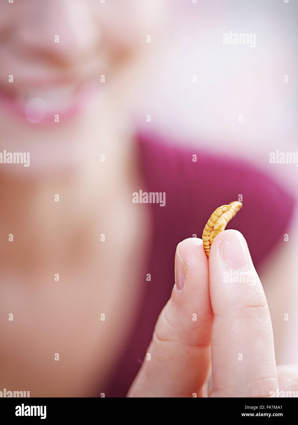 Woman eating insect closeup hi-res stock photography and images - Alamy