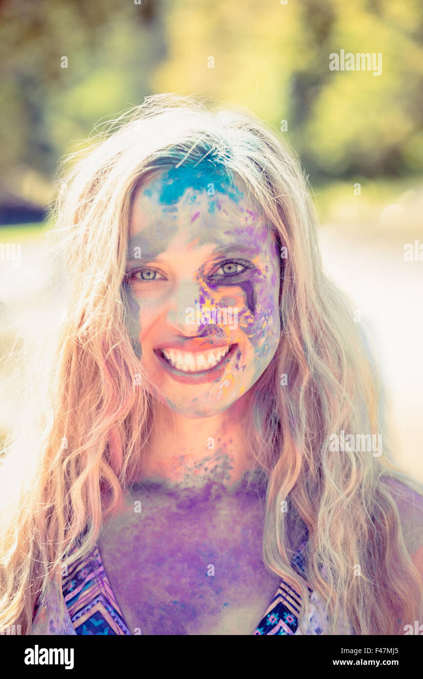 Young woman having fun with powder paint Stock Photo - Alamy