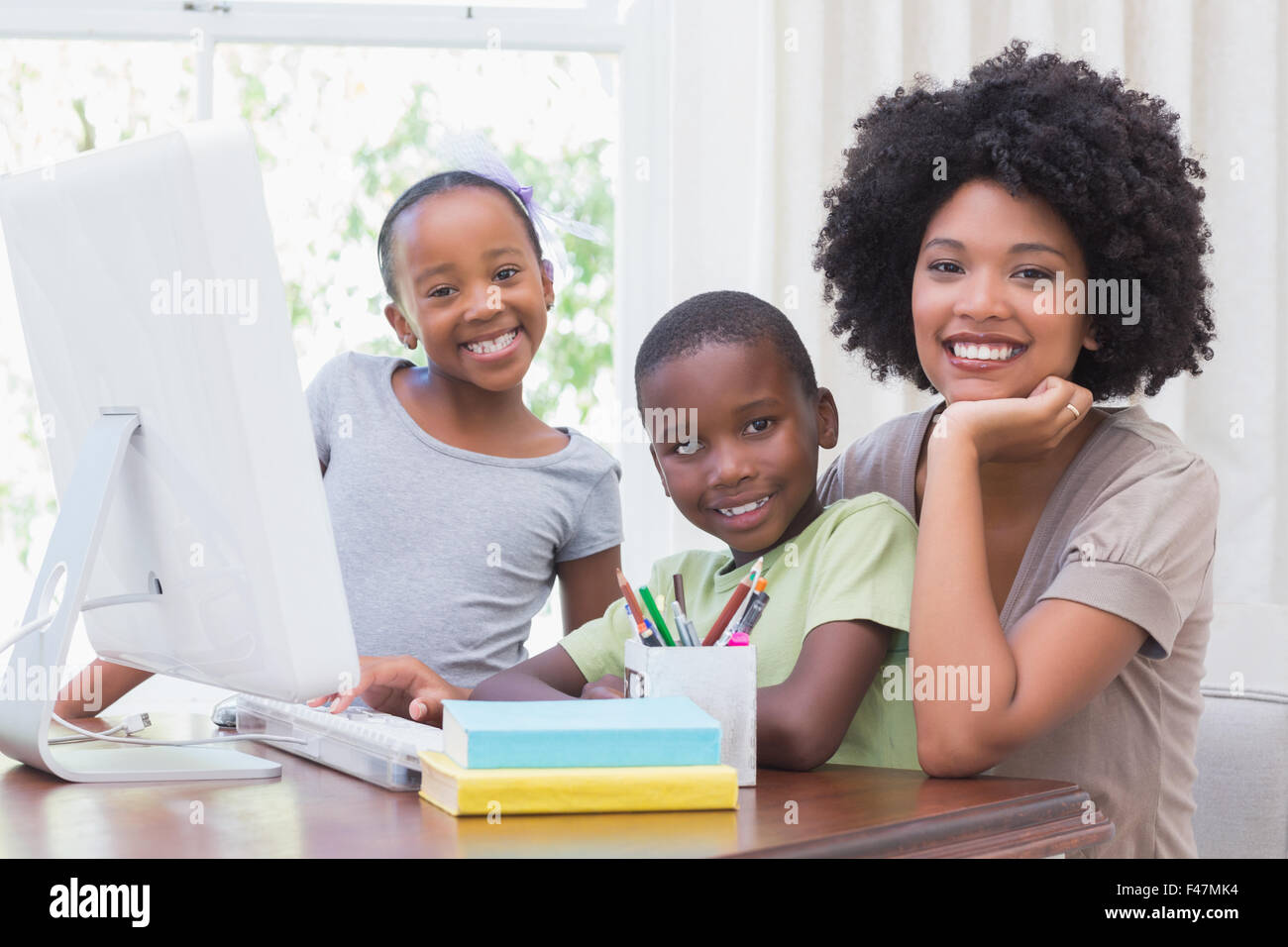 Happy family using the computer Stock Photo - Alamy