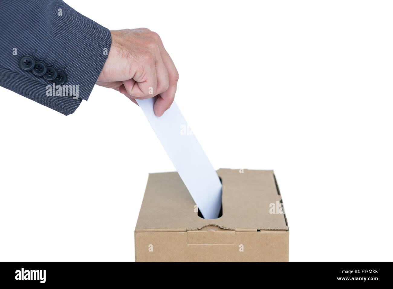 Businessman putting ballot in vote box Stock Photo - Alamy