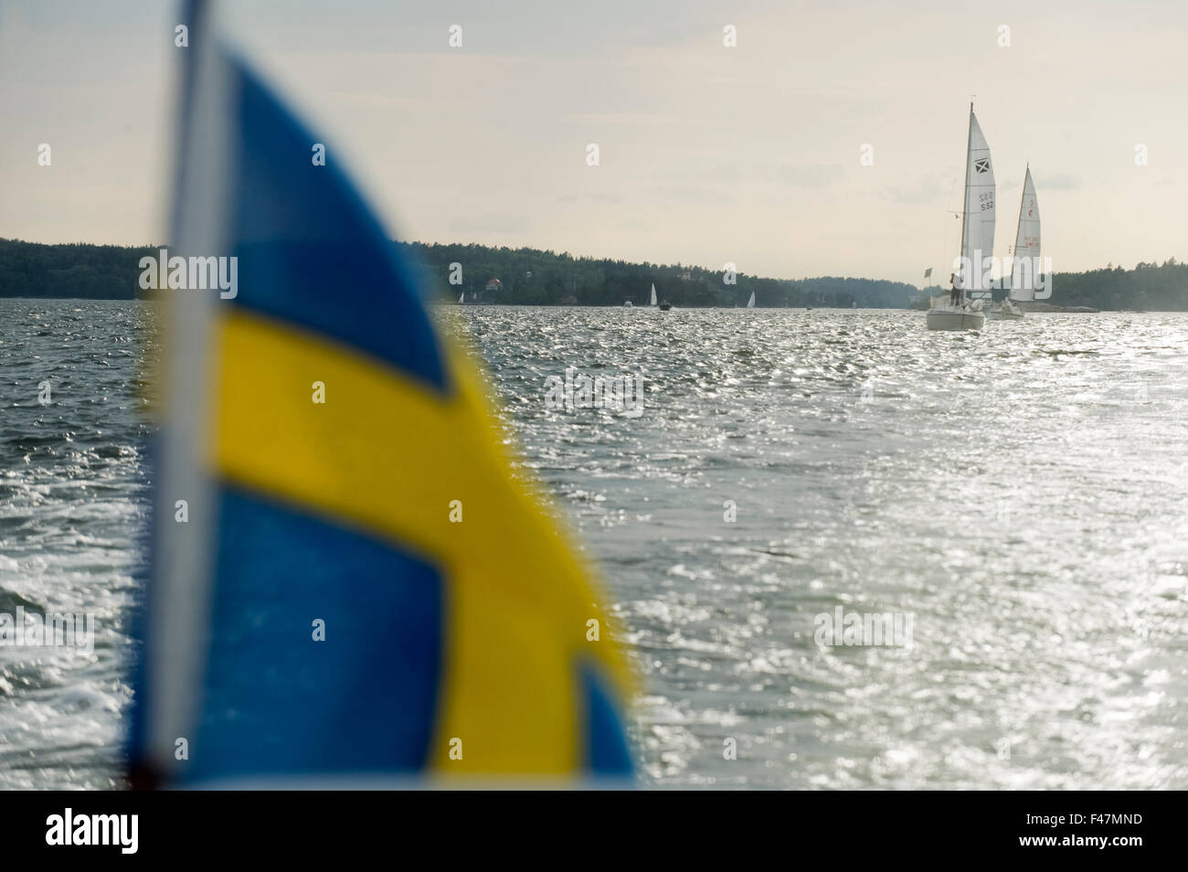 Swedish flag and sailing-boats, Stockholm archipelago, Sweden Stock ...