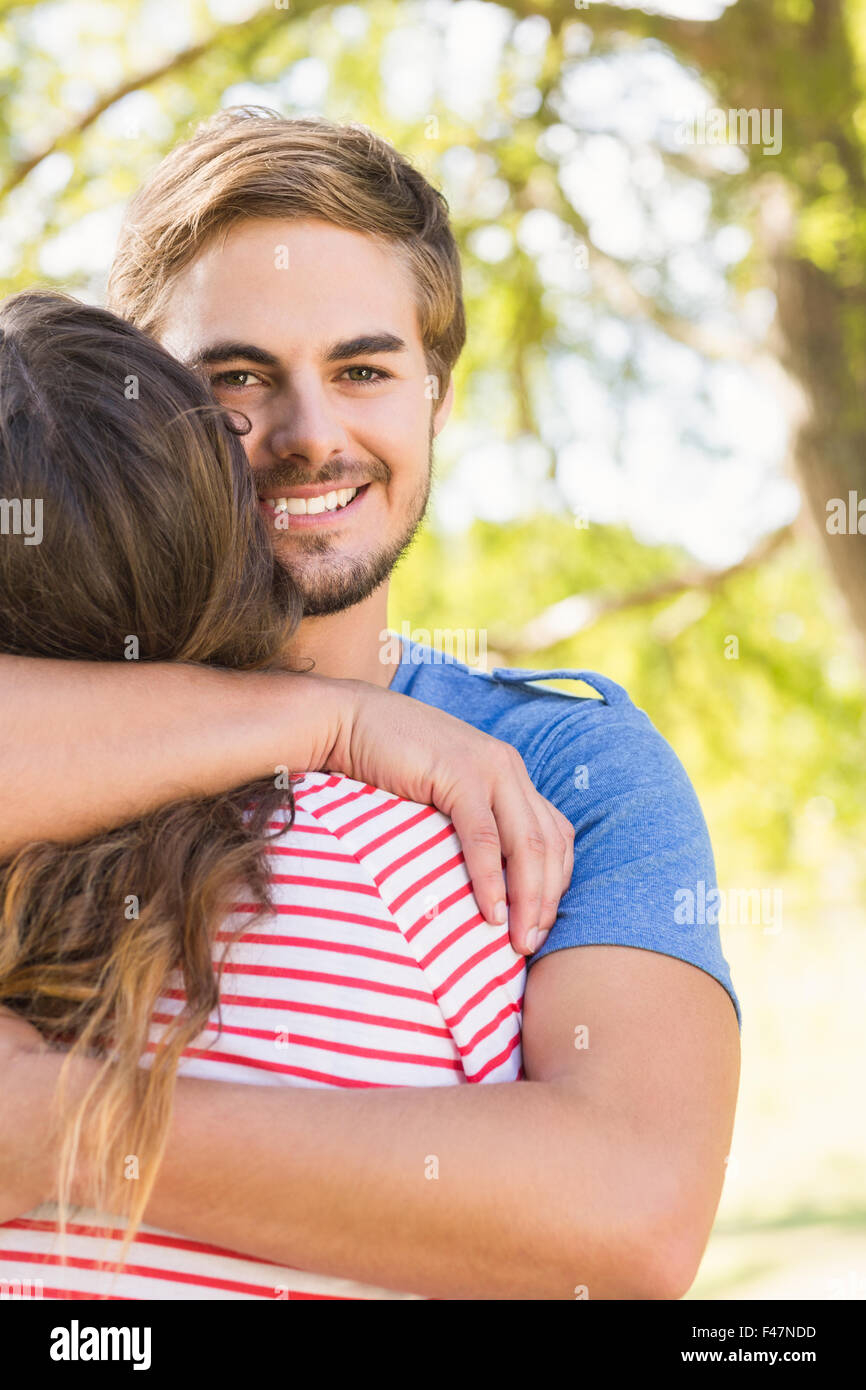 Cute couple hugging in the park Stock Photo - Alamy