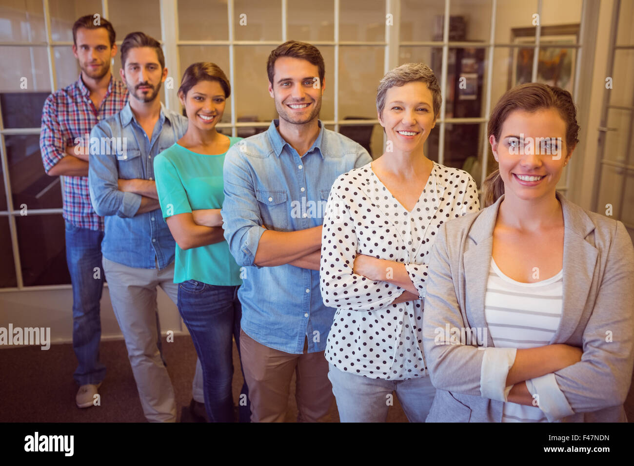 Creative business team looking at the camera Stock Photo - Alamy