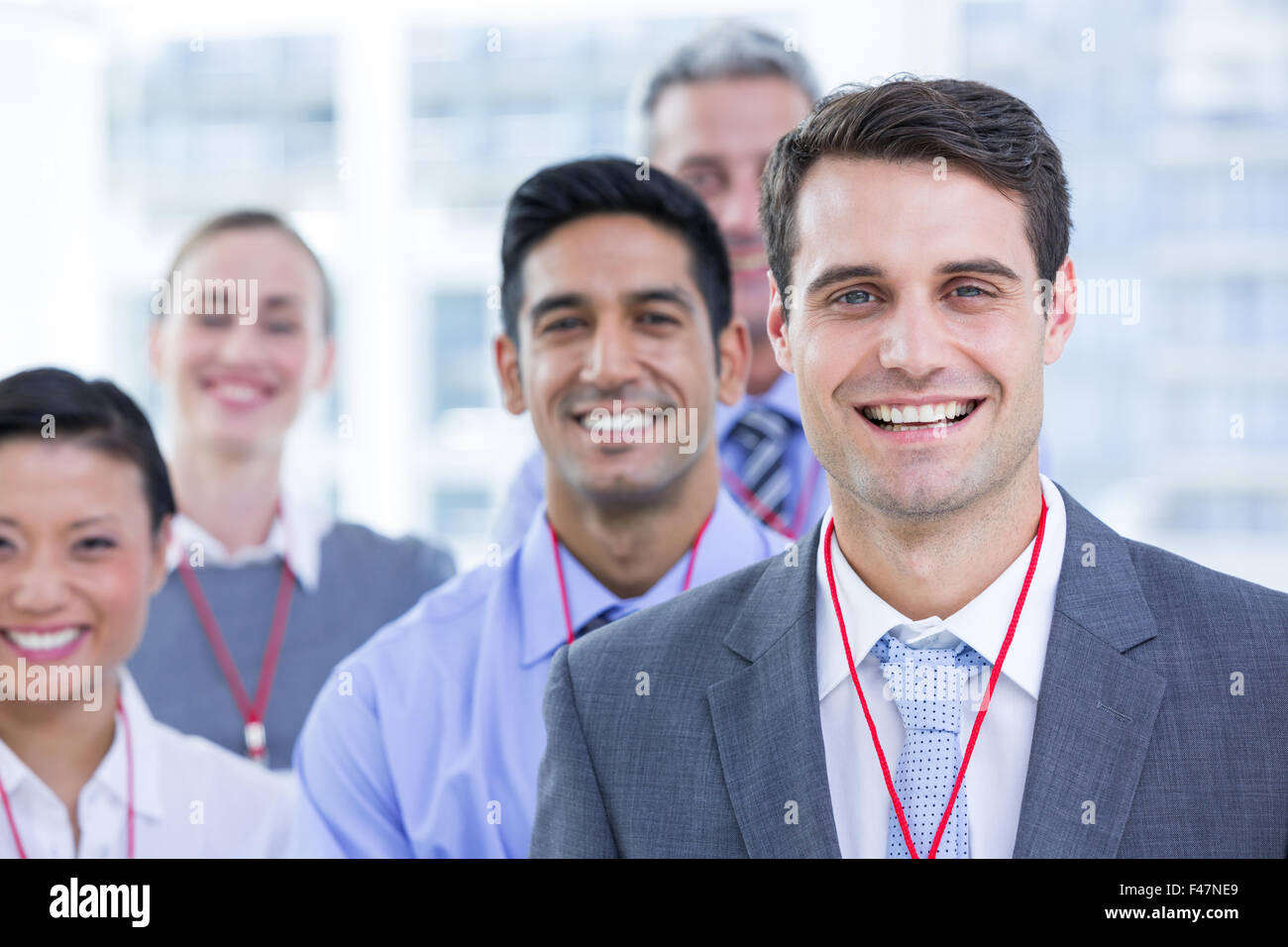 Business colleagues smiling at camera Stock Photo - Alamy