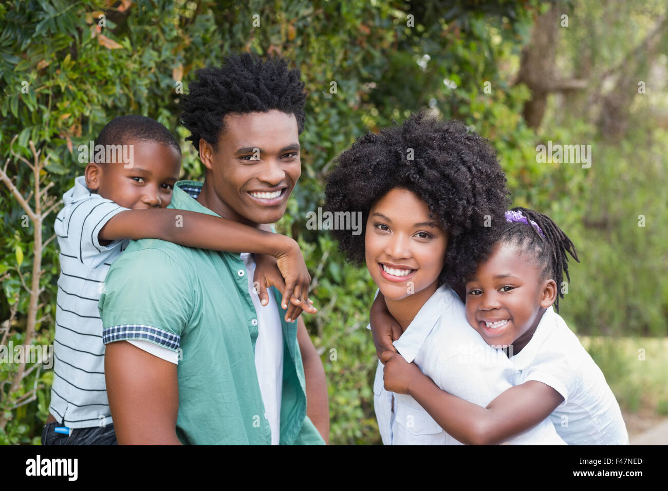 Happy family having fun together Stock Photo - Alamy