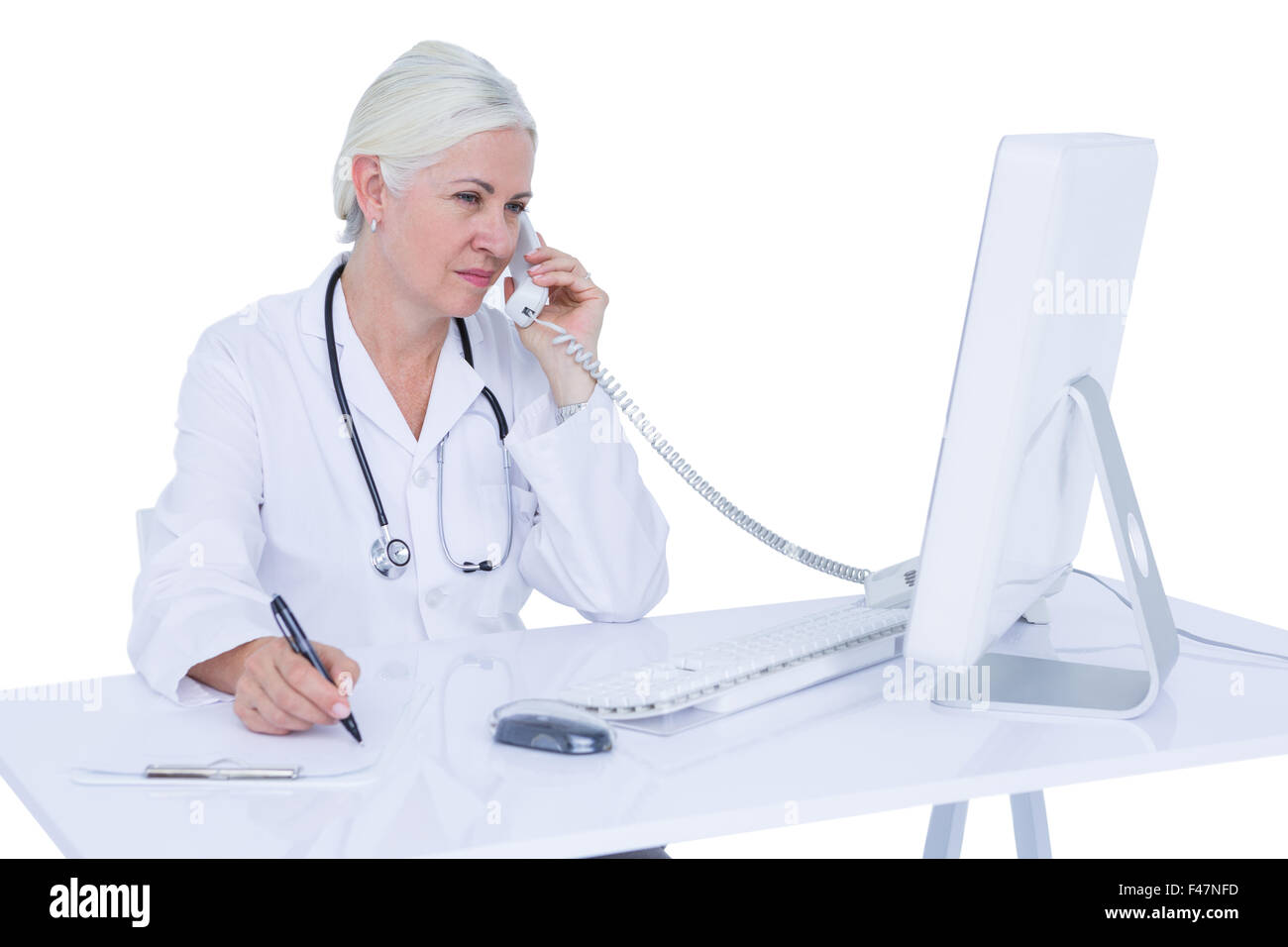 Doctor working on her computer Stock Photo - Alamy