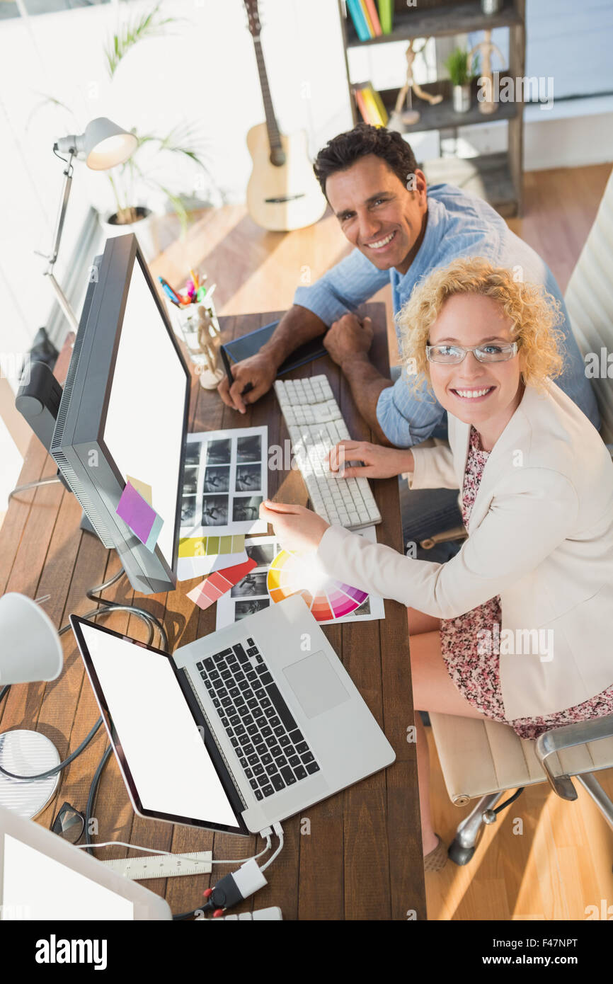 Casual business team working together with computer Stock Photo - Alamy