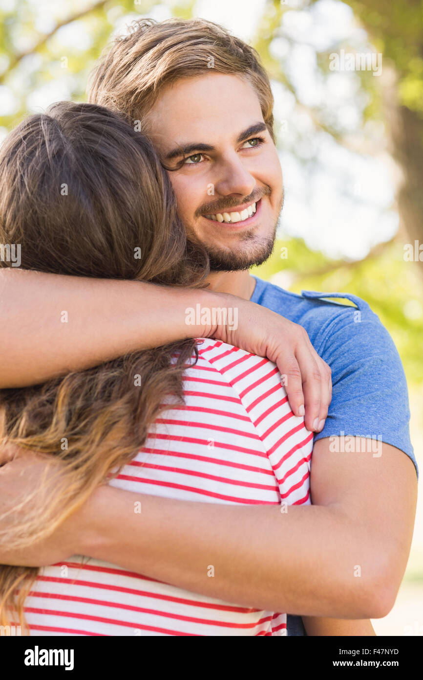 Cute couple hugging in the park Stock Photo - Alamy