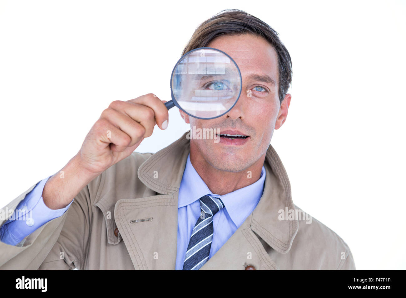 Spy looking through magnifier Stock Photo - Alamy