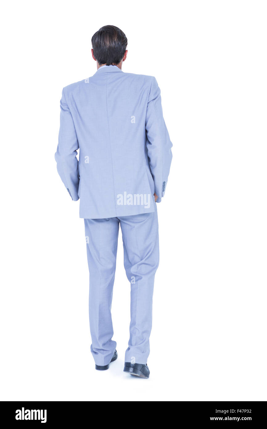 A back turned businessman on a background Stock Photo - Alamy