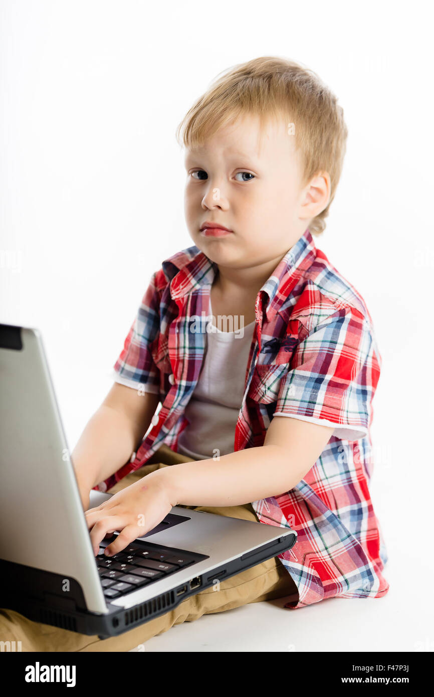 child with a laptop. studio Stock Photo - Alamy